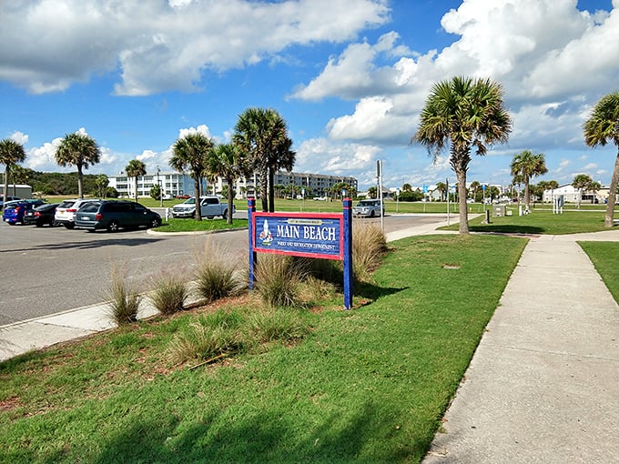 Main Beach Park's sign promises exactly what Florida vacation dreams are made of: sun-soaked days where your biggest worry is reapplying sunscreen.