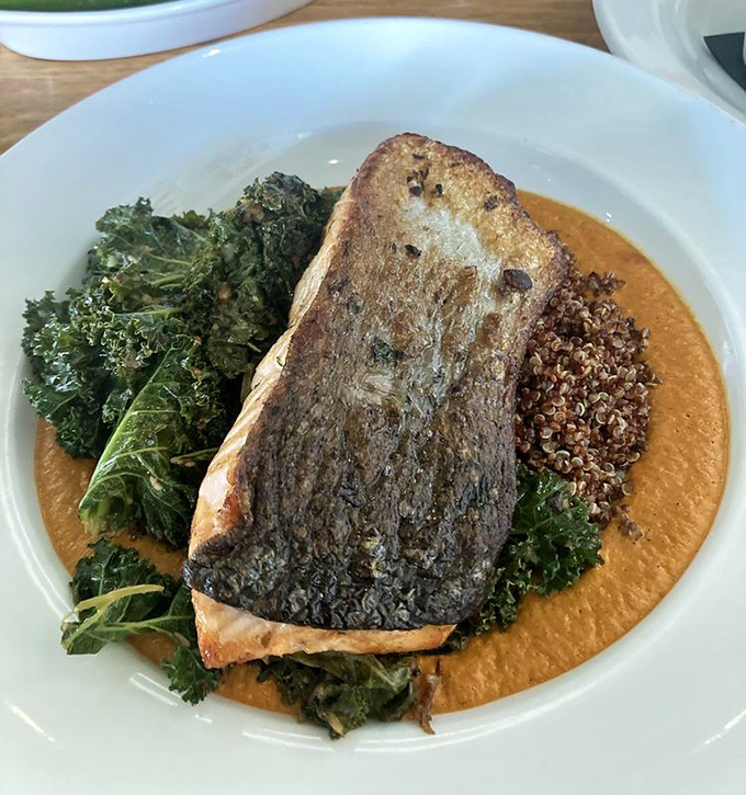 Salmon that's been given the spa treatment&mdash;marinated to perfection and served on a bed of kale with a sauce that makes you forget you're eating healthy.