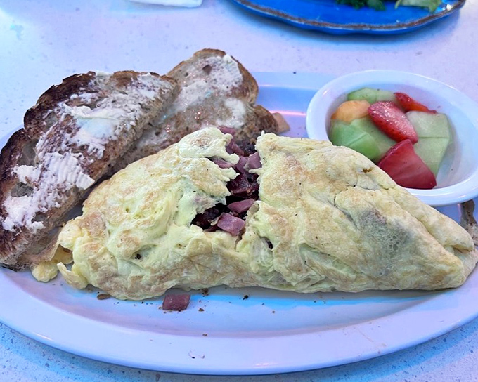 This isn't just an omelet&mdash;it's a fluffy yellow envelope delivering a love letter of ham and cheese to your taste buds.