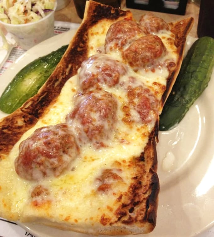 
Melted cheese stretching from bread to meatball like the world's most delicious game of connect-the-dots. A sandwich that demands both napkins and respect. 
