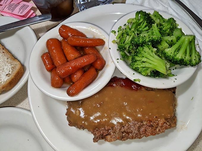 Meatloaf dinner with all the fixings—the kind of plate that makes you nostalgic for Sunday dinners you might not have even experienced.