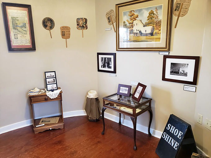 A mini-museum of memorabilia tells the Shoe House story. That "Shoe Shine" sign is both thematically perfect and a nod to the building's inspiration.