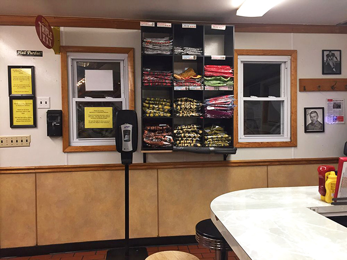 The merchandise wall: where Triple XXX fans can take home everything except the grill cook's secret timing techniques.