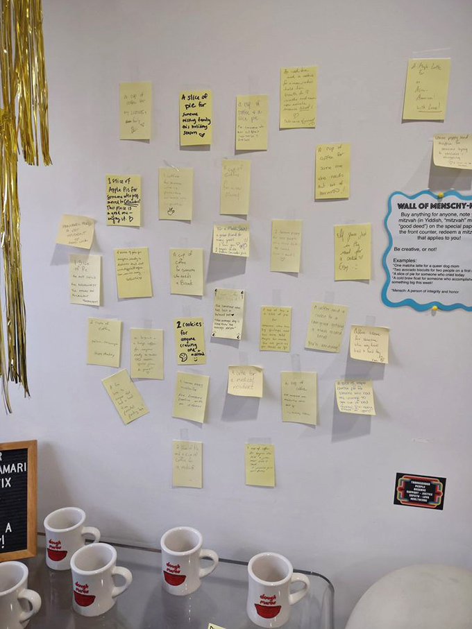 The "Wall of Menschyness" where customers pay kindness forward. In a world of digital connections, these handwritten notes feel wonderfully human.