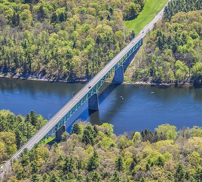 The Milford-Montague Toll Bridge stretches across the Delaware like a green metal ribbon connecting two states and countless memories.