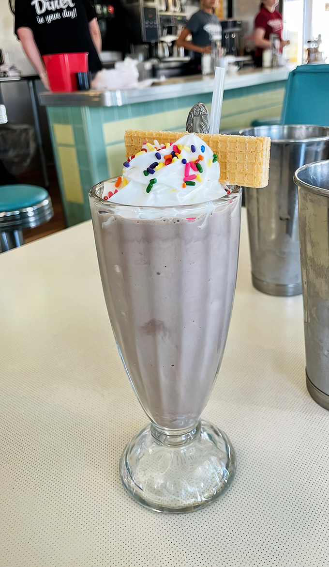 Milkshake masterpiece topped with whipped cream, sprinkles, and a wafer cookie. Not just a drink&mdash;it's dessert with a straw and zero regrets.