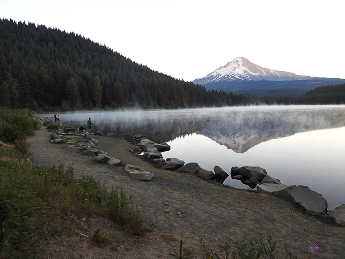 Morning mist meets mountain majesty. This tranquil lake scene proves that Oregon mornings are worth setting your alarm for.