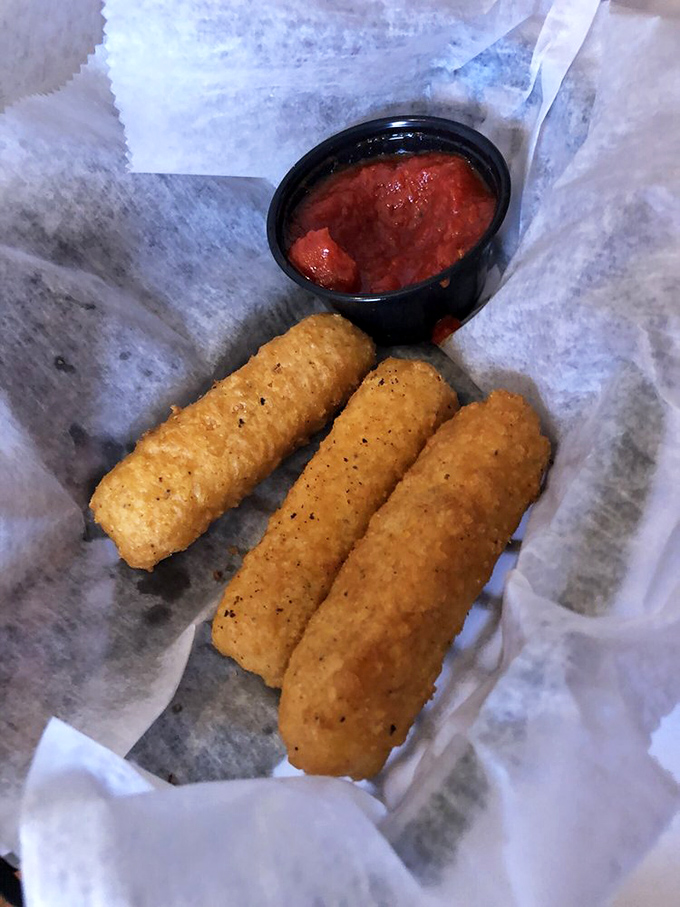 Mozzarella sticks: proof that humans will always find ways to improve cheese. These golden cylinders with marinara are simple, perfect happiness.