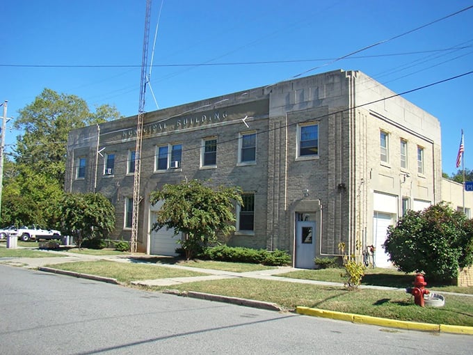 The Municipal Building stands as a no-nonsense reminder that even paradise needs someone to keep the streetlights working.