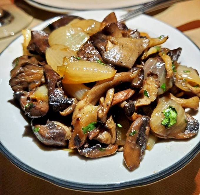 Saut&eacute;ed mushrooms and onions&mdash;the unsung heroes of any steakhouse experience. These aren't just sides; they're supporting actors deserving of awards.