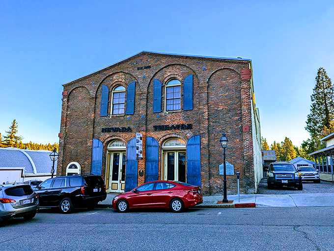 The historic Nevada Theatre's brick facade has welcomed audiences since 1865. Entertainment before streaming services, with better intermission snacks.