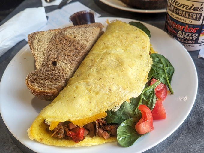 An omelet that puts your homemade breakfast attempts to shame. Stuffed with veggies and served with toast that's actually worth eating.