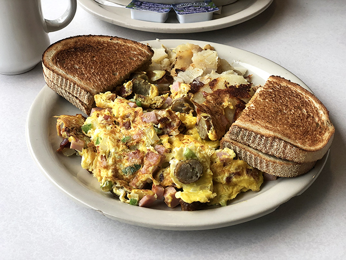 An omelet that doesn't hold back. Packed with ham, veggies, and melty cheese, it's the breakfast equivalent of a bear hug.