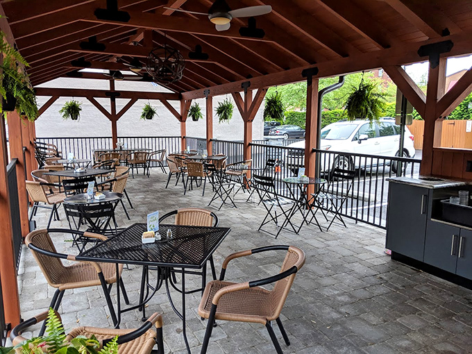 Outdoor dining under wooden beams &ndash; because sometimes your crepe needs fresh air and vitamin D to taste its best.
