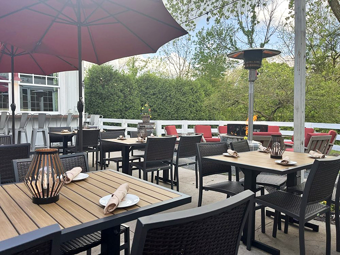 The outdoor patio where fresh air enhances flavor and umbrella-shaded tables invite you to linger just a little longer.