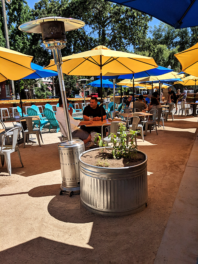 California sunshine and yellow umbrellas create the perfect outdoor dining oasis. Even the heat lamps look happy to be here.