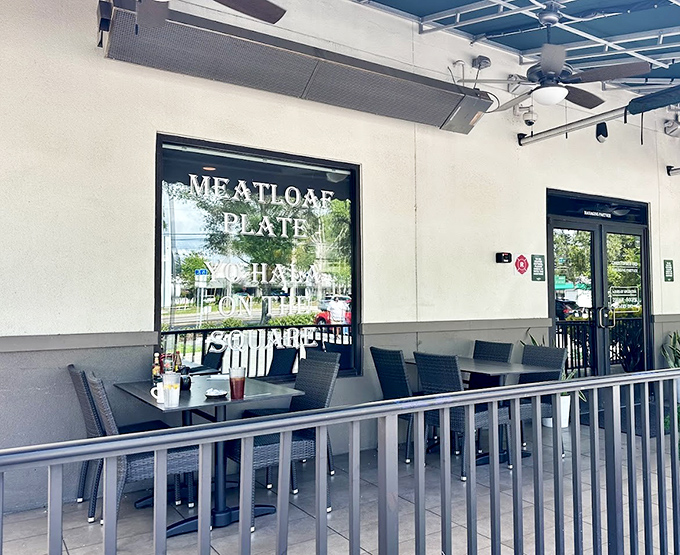 Meatloaf Plate proudly displayed on the window like a family name. The outdoor seating says, "Florida weather is too good to waste."