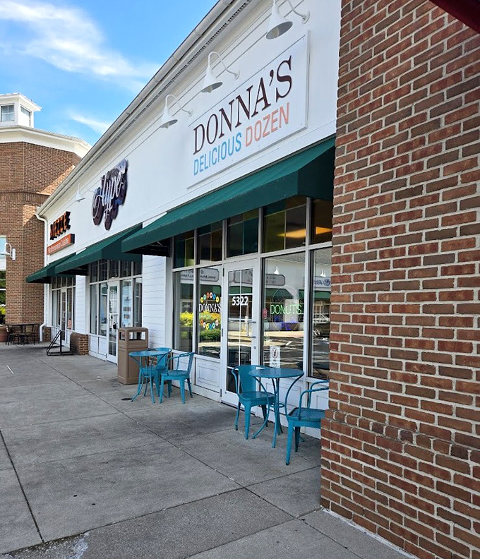 Those teal tables outside aren't just seating&mdash;they're front-row tickets to the best show in town: watching your donut disappear. 