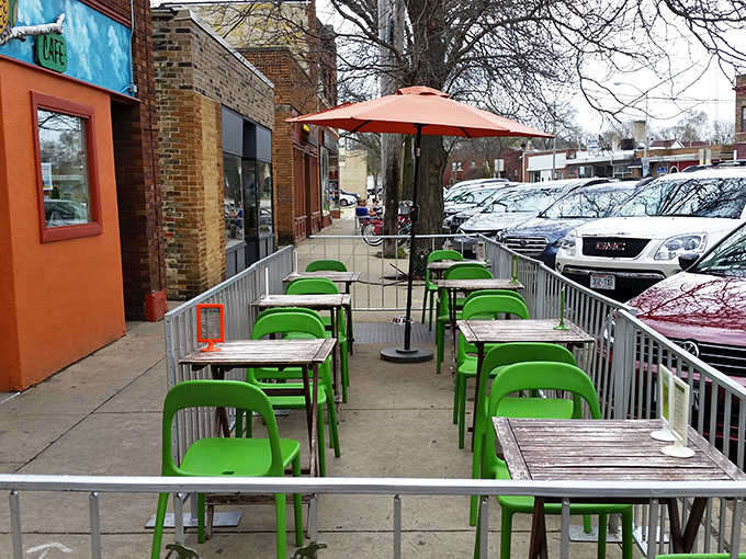 The sidewalk seating area's bright green chairs pop against the urban backdrop&mdash;Madison's answer to Parisian cafe culture.