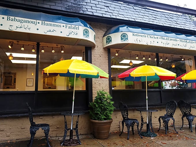 Colorful umbrellas stand guard over outdoor tables, creating little islands of al fresco dining on a busy Philadelphia corner.