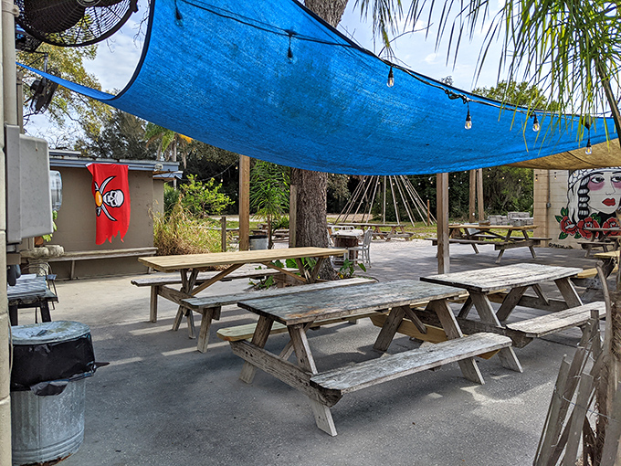 Picnic tables under blue shade sails create the perfect casual setting for serious eating. No white tablecloths needed when the food is this good.