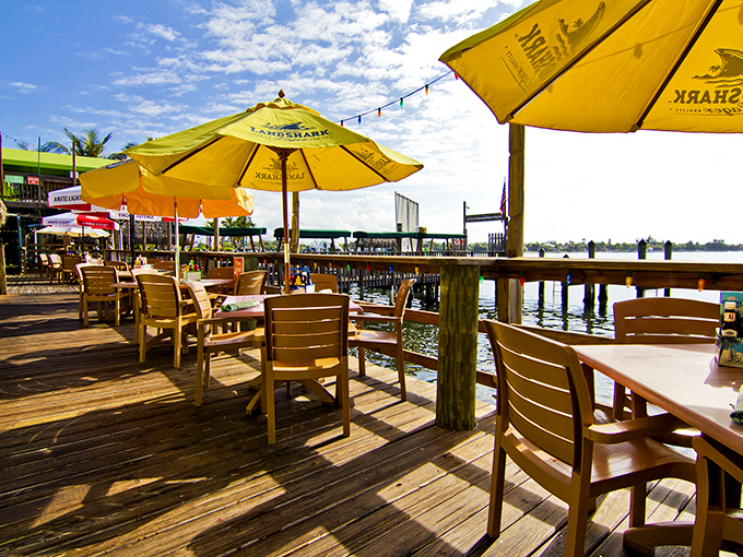 Waterfront dining under yellow umbrellas &ndash; because vitamin D and vitamin "sea" are essential parts of the Florida diet.