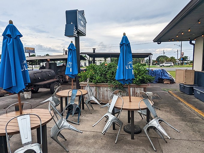 Metal chairs and wooden picnic tables create that perfect "no fuss" dining atmosphere where the only thing that matters is what's on your tray.