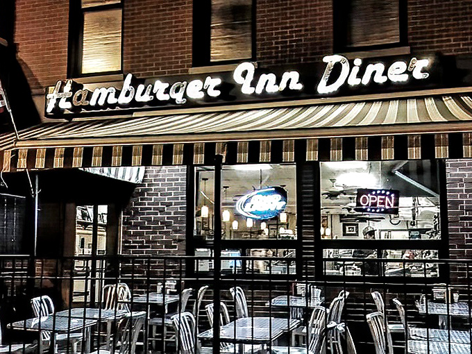 As night falls, the Hamburger Inn glows like a beacon of hope for the hungry. Late-night cravings have met their match.