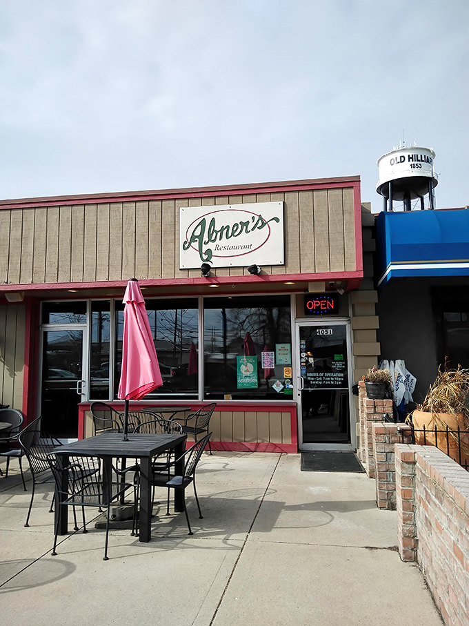 Even on cloudy days, Abner's exterior promises sunshine inside&mdash;a beacon of breakfast hope in Hilliard with the town's water tower standing guard.