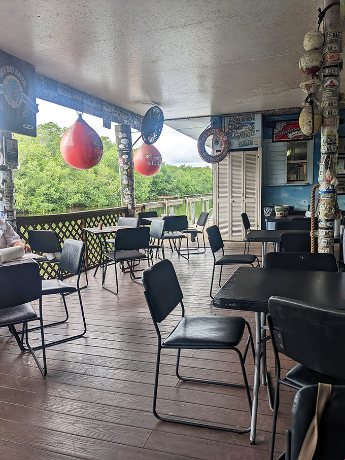 Outdoor seating that offers the Florida trifecta: water views, mangrove breezes, and the promise of something delicious heading your way.