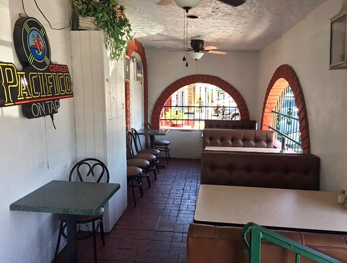 The cozy patio area offers a more casual vibe, where brick floors and arched windows create a courtyard feel that's pure Arizona-meets-Mexico charm.
