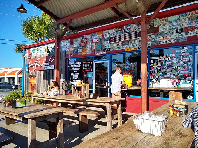 Outdoor seating where license plates tell stories and barbecue brings everyone together under Georgia skies.