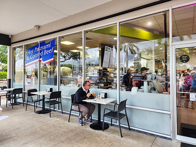 Al fresco dining, Florida-style. This lone diner has mastered the art of securing the coveted outdoor table for people-watching between bites.