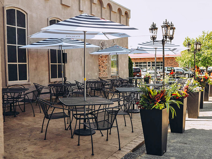 Summer in Illinois means dining al fresco under striped umbrellas, where gentle breezes carry the scent of garlic and possibility.