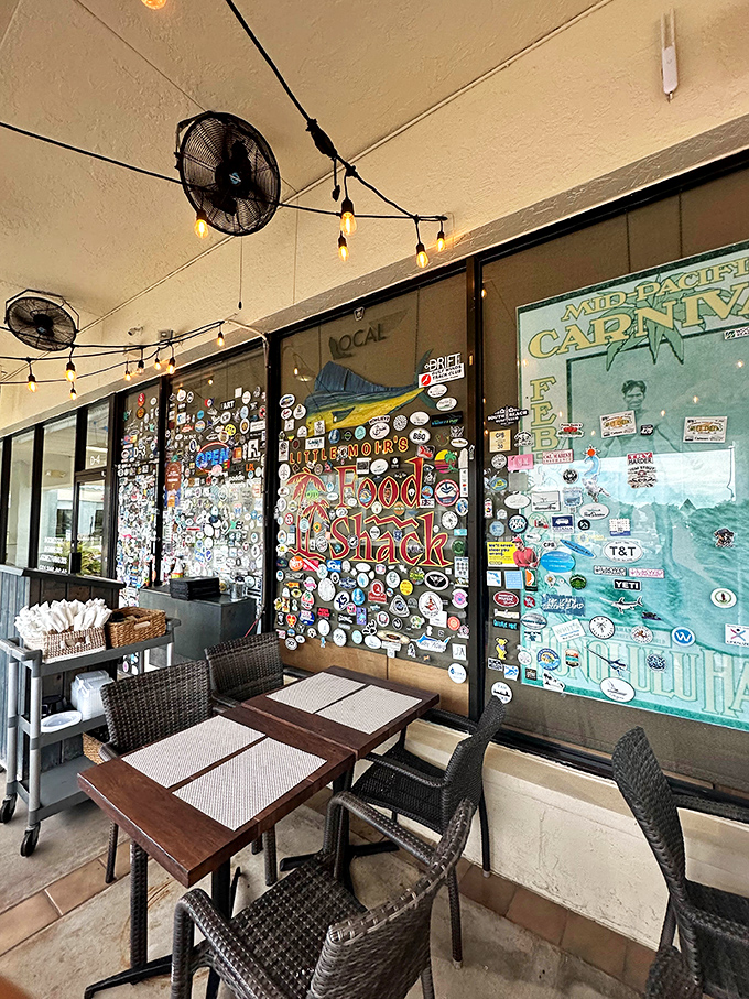 The outdoor seating area's walls are plastered with stickers that tell the story of everyone who's ever fallen in love with this place.