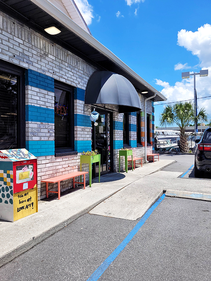 The inviting entrance that's become a Charleston landmark. Those colorful benches outside aren't just for waiting—they're front-row seats to Savannah Highway people-watching.
