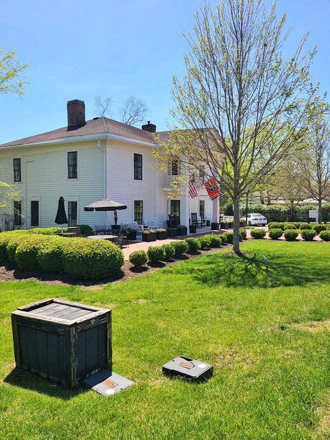 Spring sunshine bathes the historic white clapboard building, where rocking chairs patiently wait for visitors to sit a spell after a satisfying meal.