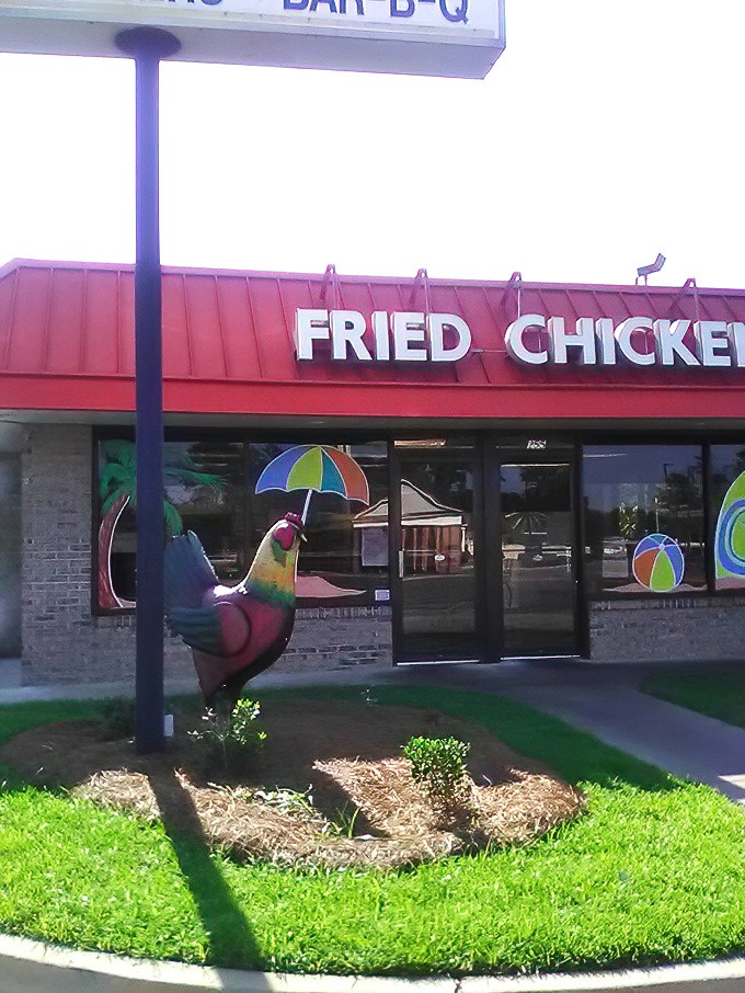 Even the rooster statue outside knows this place is special—he's dressed in his Sunday best to greet hungry visitors.