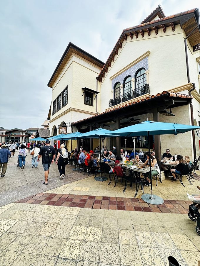 Al fresco dining under blue umbrellas, where Disney Springs shoppers pause to refuel. The perfect people-watching perch with plates of perfection.