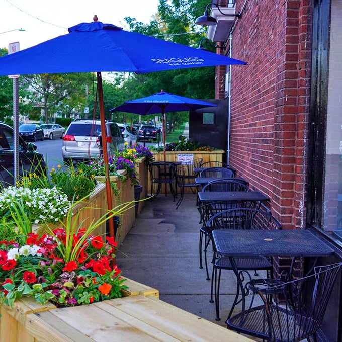 Outdoor seating surrounded by flowers creates the perfect setting for al fresco dining with European charm.