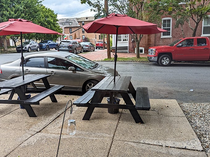 Outdoor dining under red umbrellas offers the perfect perch for people-watching while debating whether to order dessert. (The answer is always yes.)