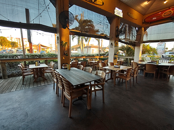 The covered patio offers al fresco dining with protection from Florida's afternoon showers. Perfect for enjoying ribs while watching palm trees sway.