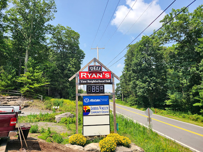 The roadside sign stands like a beacon of hope for hungry travelers. Those yellow flowers seem to say, "Turn here for happiness!"