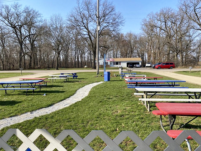 The outdoor dining room where Michigan summers shine brightest &ndash; picnic tables waiting for the next round of burger enthusiasts.