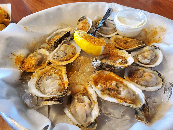 Oysters lounging on ice like celebrities at a spa, sprinkled with spice and waiting for their lemon squeeze of fame.