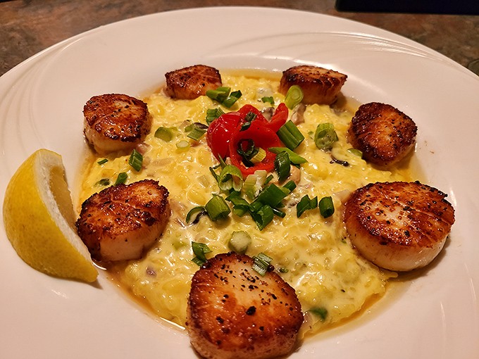 Seven perfectly seared scallops form a crown around creamy risotto &ndash; a dish so pretty you almost don't want to eat it. Almost.