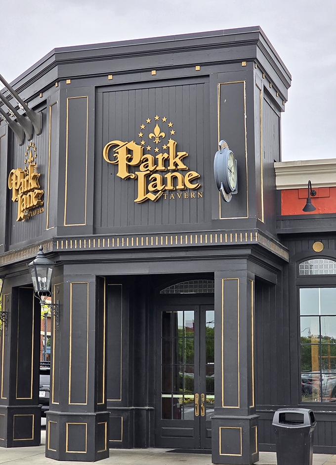 Park Lane Tavern's elegant fa&ccedil;ade with gold accents and dramatic black exterior hints at the European-inspired experience waiting inside.