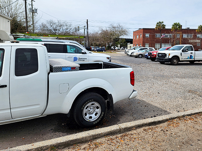 Even the parking lot tells a story&mdash;work trucks and family cars side by side, because great burgers are the ultimate equalizer.