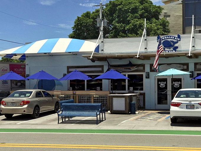 The exterior view that's launched a thousand seafood cravings – complete with that iconic blue and white awning beckoning hungry travelers.