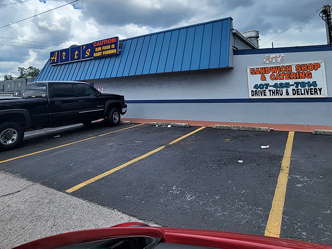 The parking lot where hungry pilgrims complete their journey. These spaces have witnessed countless pre-sandwich anticipation moments.